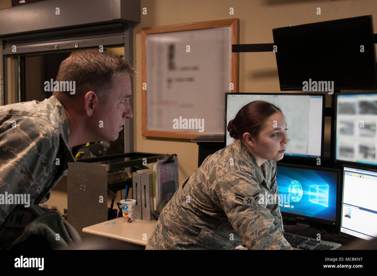 Col. Benjamin Spencer, 319th Air Base Wing commander (right), briefs ...