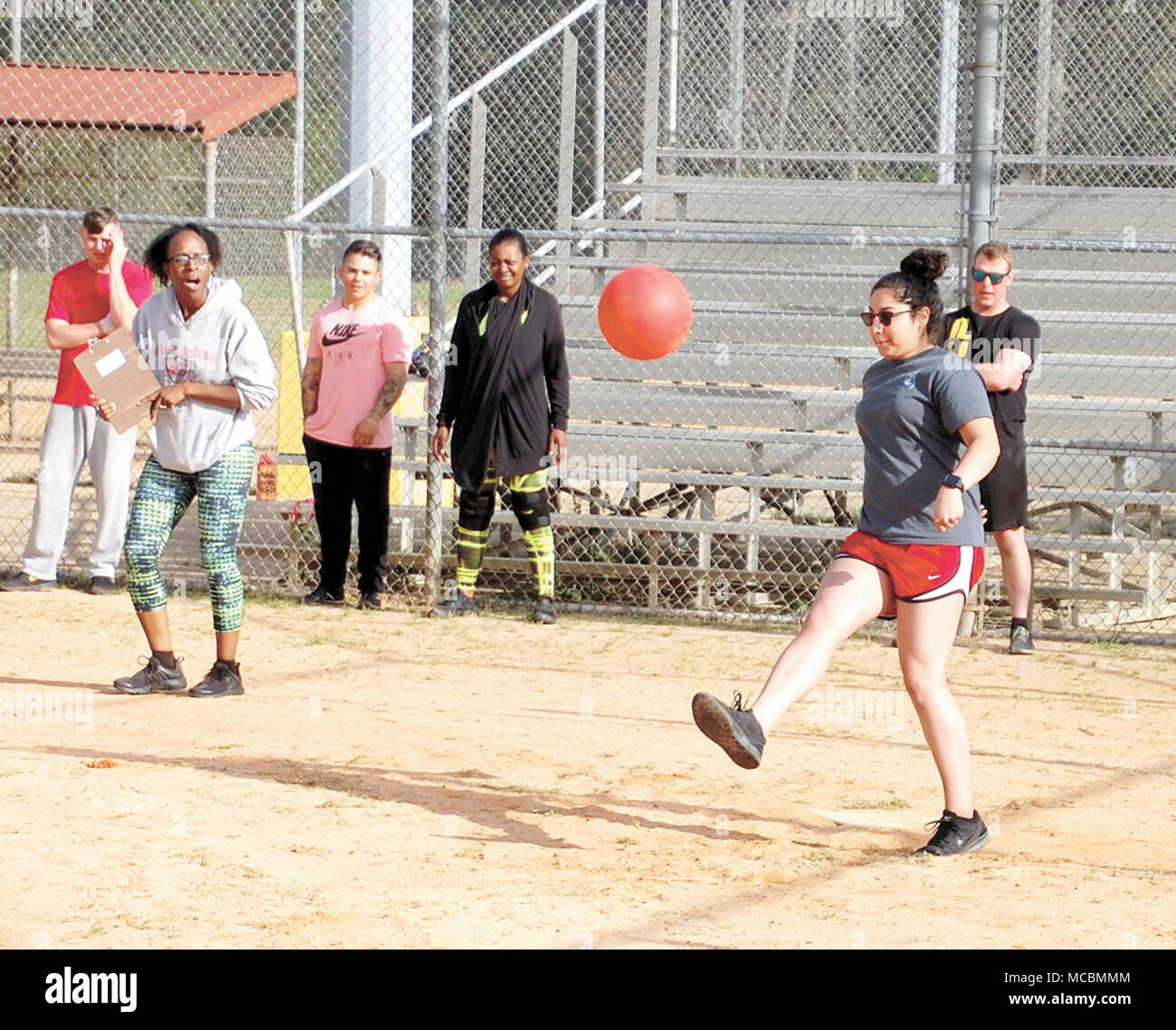 Spc. Patrician Fuentez, 115th CSH, takes her turn at kick ball as her ...