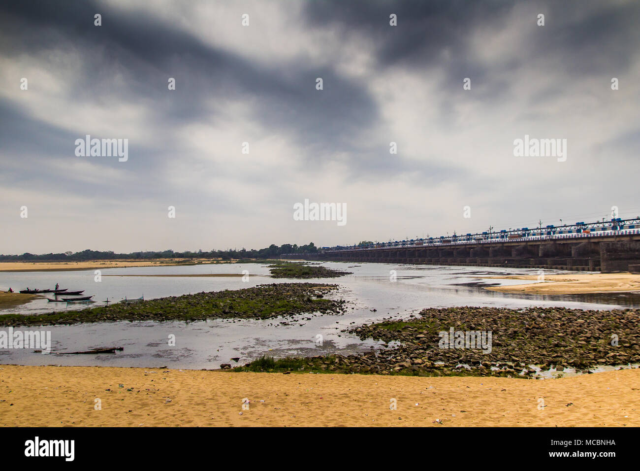 landscape HDR scene of river bed sandy beach with cloudy sky Stock ...