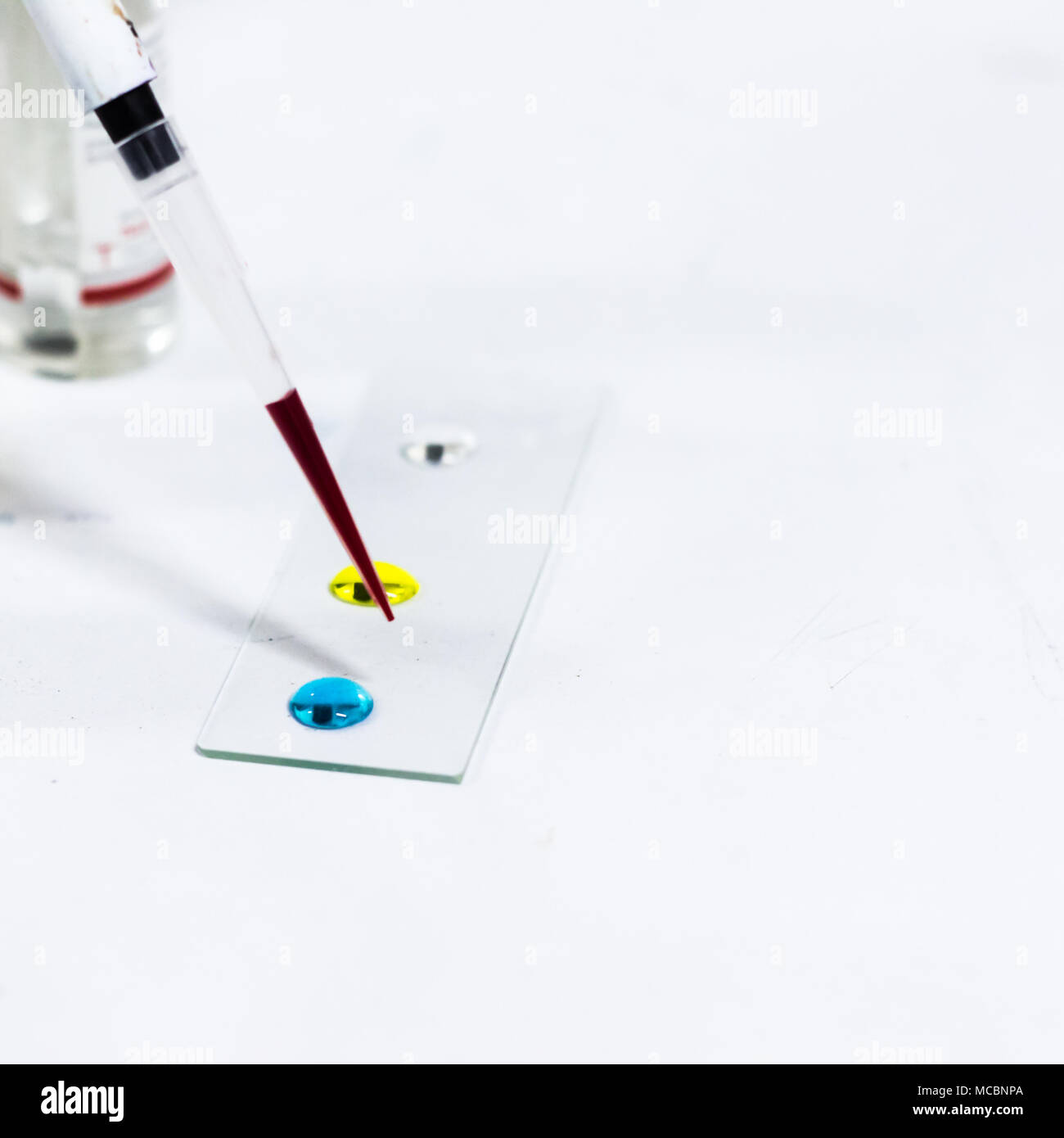 drop of blood on glass slide for blood grouping using micro tip Stock ...