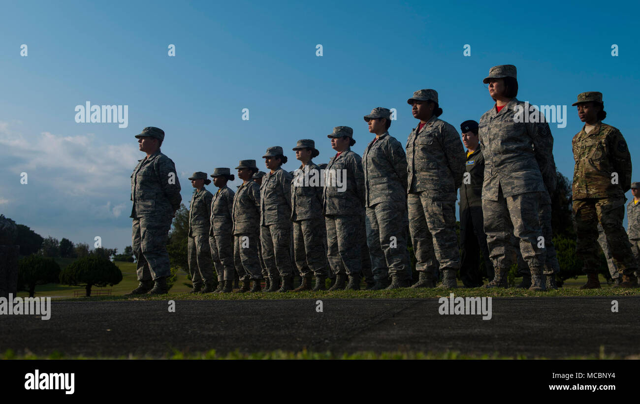 U.S. Air Force Airmen stand parade rest before a retreat ceremony Mar ...