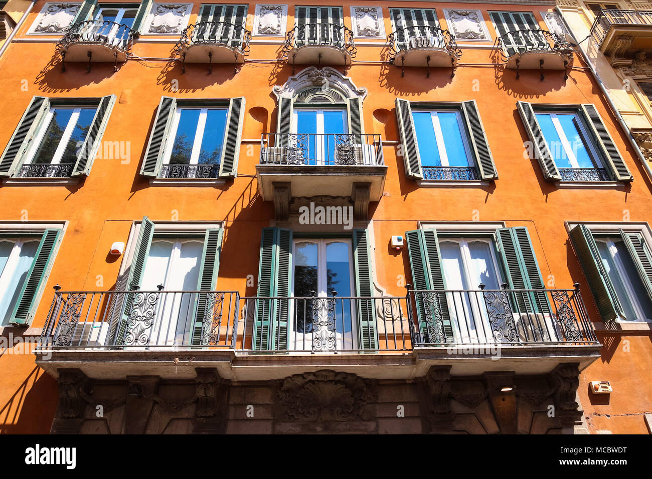 Facade of traditional colorful european italian apartment building in ...