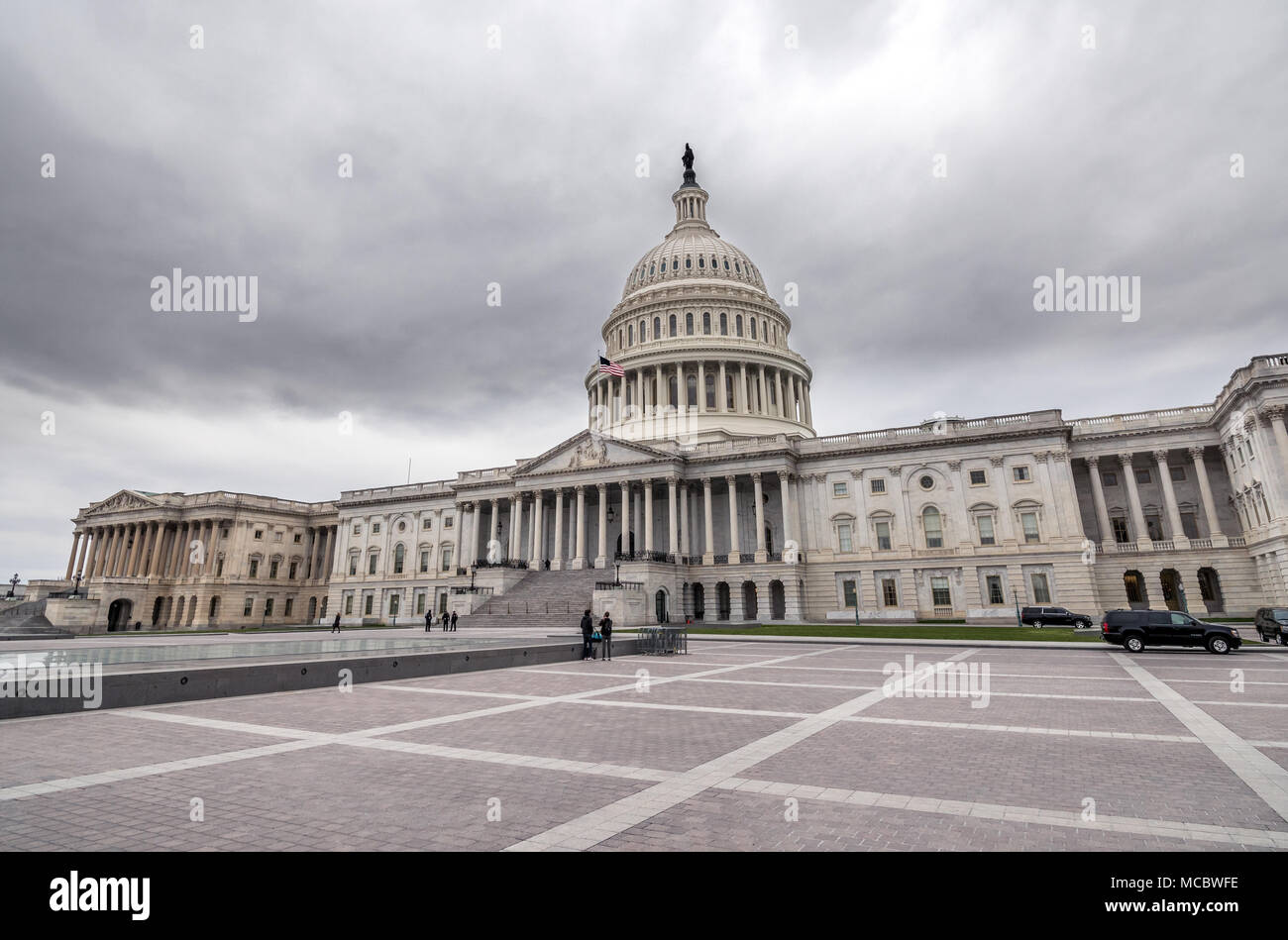 The United States capitol building with dark sclouds above Stock Photo ...