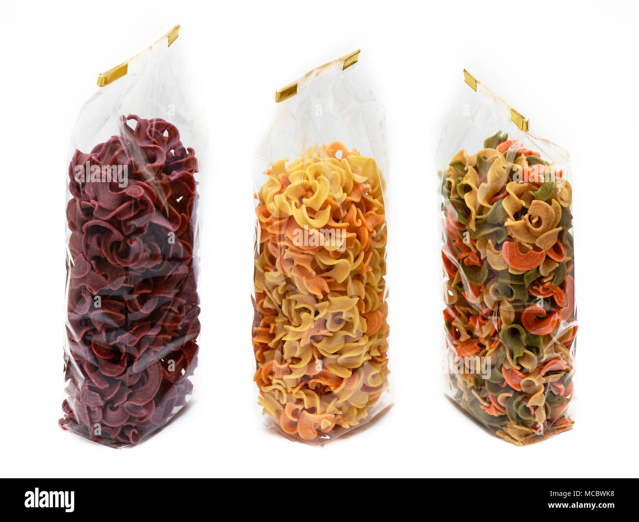 Dried three pasta in bag front view. Colorful vegetable pastas on ...