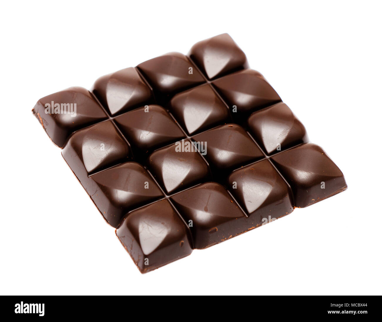 Chocolate pieces. Chopped dark chocolate closeup white isolated Stock ...