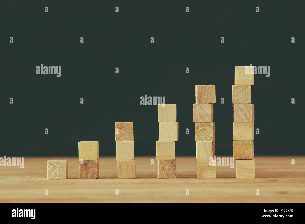 wooden blocks stacking as chart or ladder. concept for growth and ...