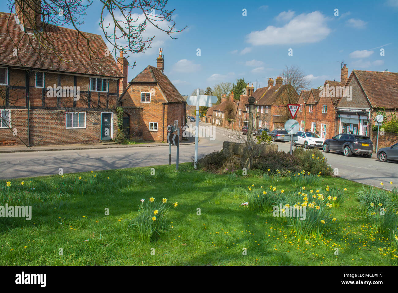Aldermaston village in Berkshire, UK, with spring flowers and blue sky ...