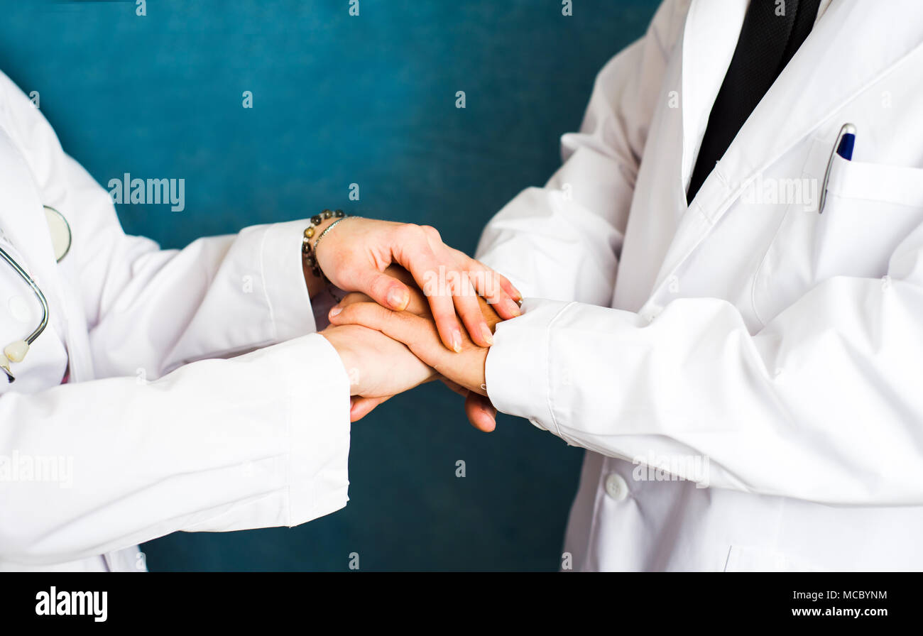 Two hands on top of each other hi-res stock photography and images - Alamy