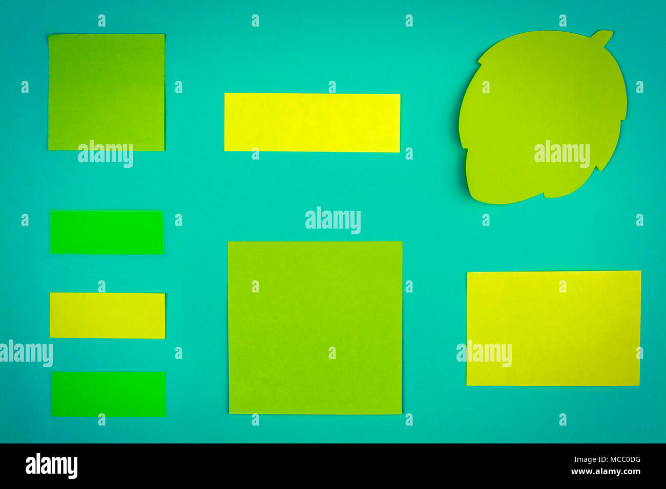 Colorful post it notes for messages on green background Stock Photo - Alamy