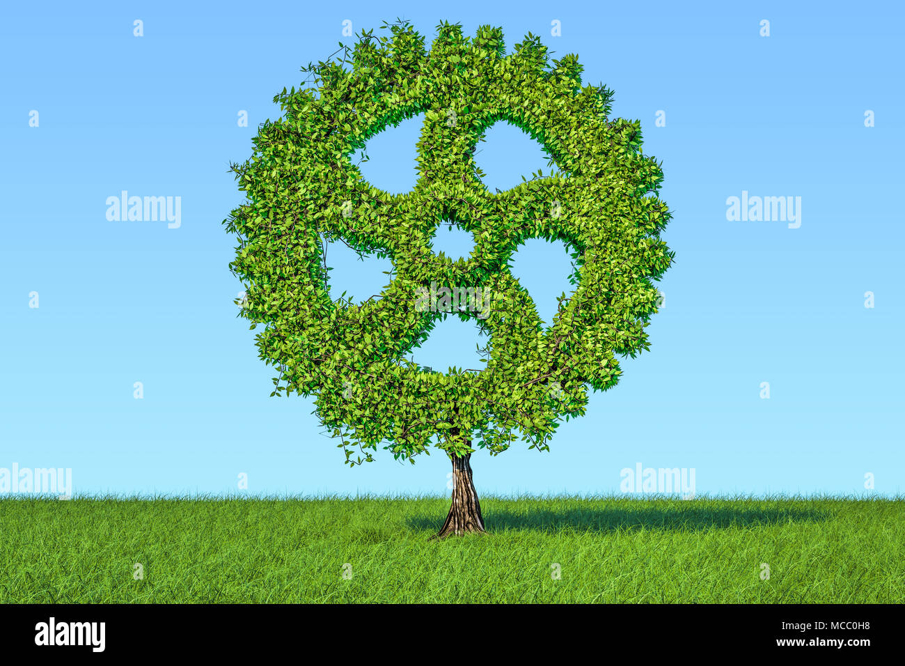 Business industrial tree in the shape of gear on the green grass ...