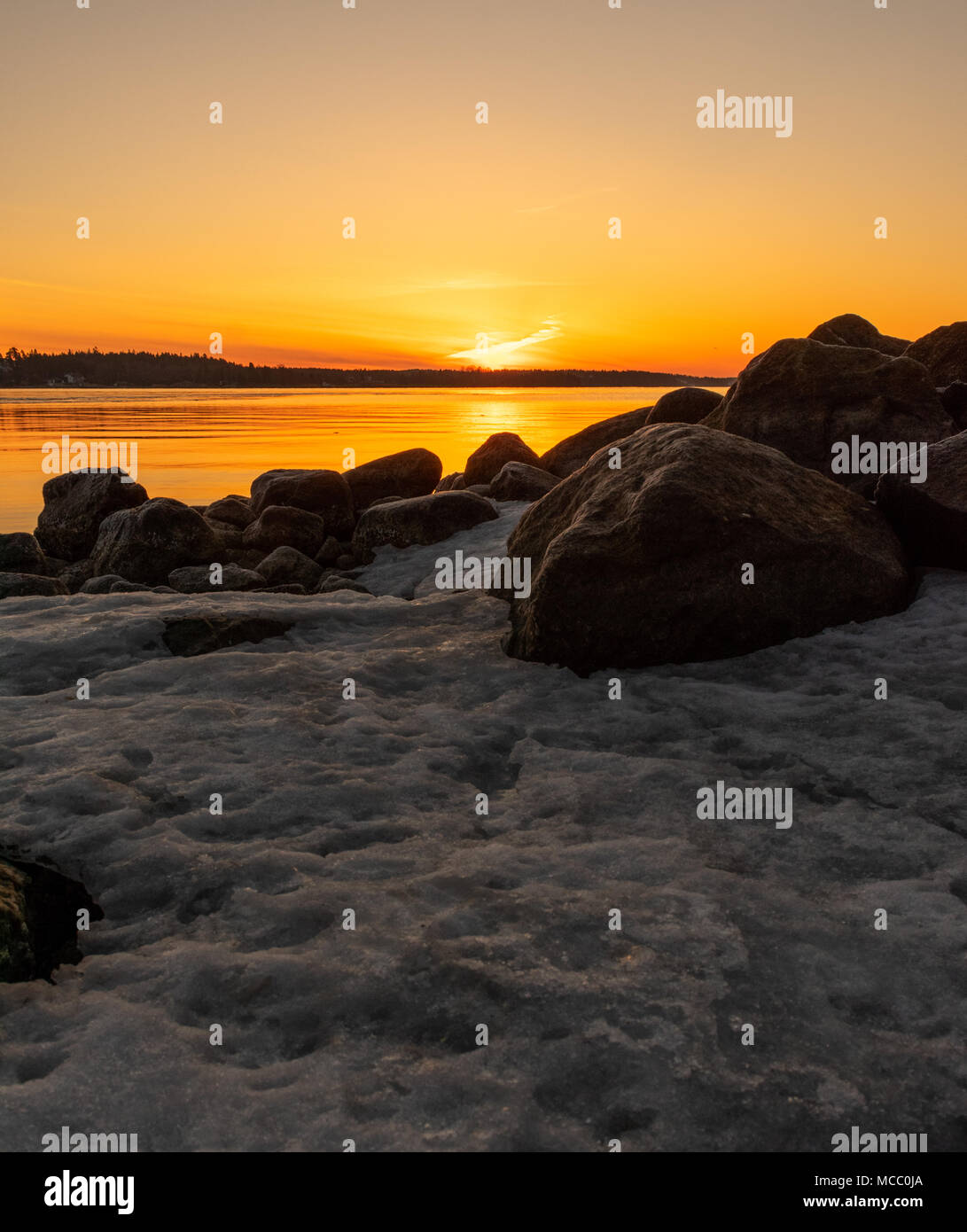 Sunrise over water Stock Photo - Alamy