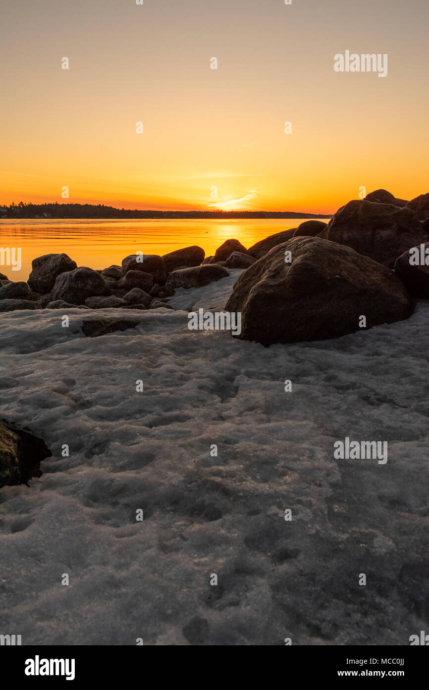 Sunrise over water Stock Photo - Alamy