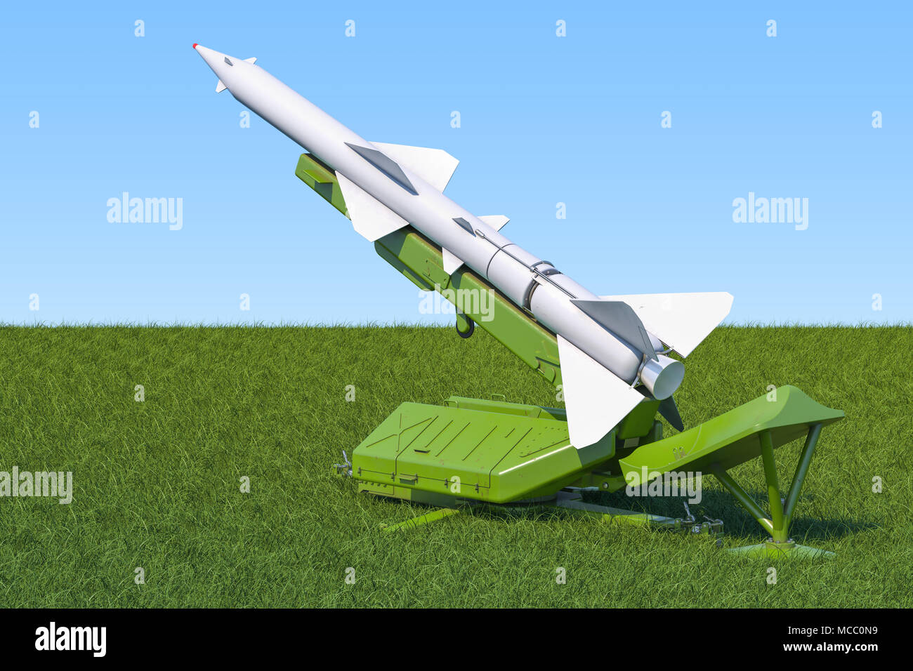 Missile defence system on the green grass against blue sky, 3d ...