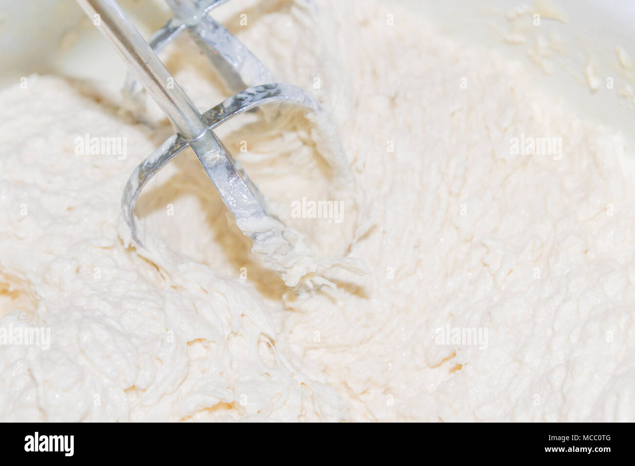 The mixing of the cream with a mixer Stock Photo - Alamy