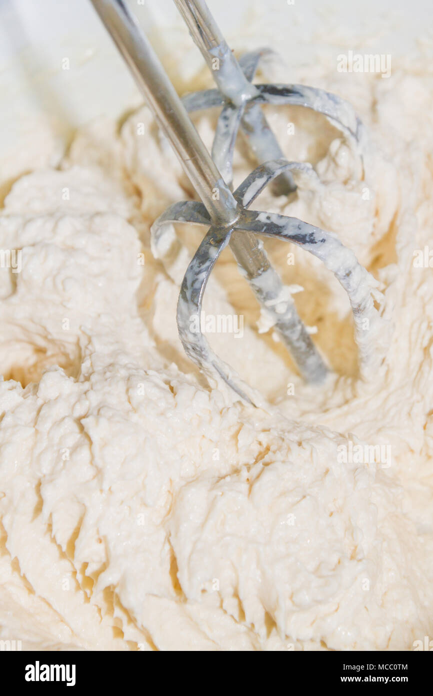 The mixing of the cream with a mixer Stock Photo - Alamy