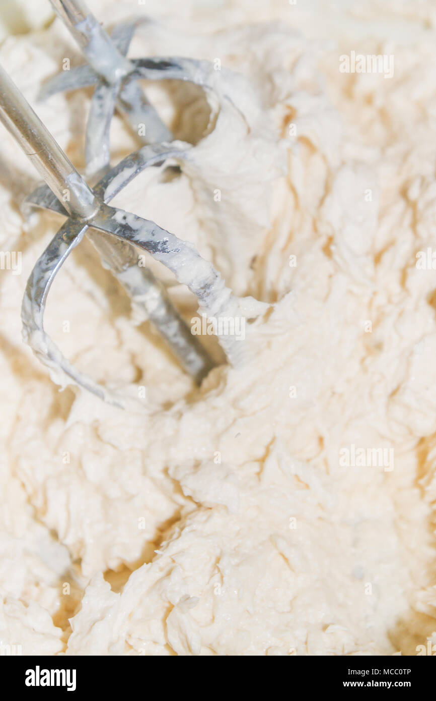 The mixing of the cream with a mixer Stock Photo - Alamy