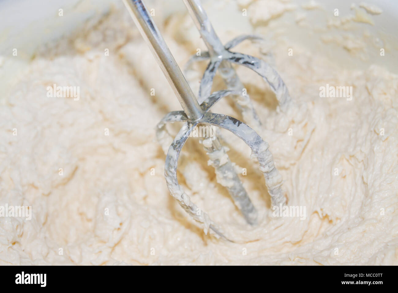 The mixing of the cream with a mixer Stock Photo - Alamy