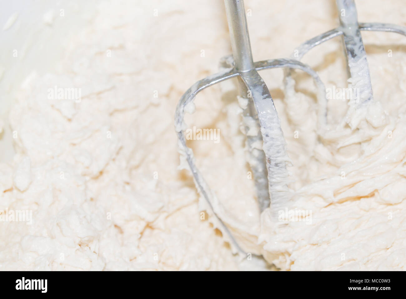The mixing of the cream with a mixer Stock Photo - Alamy