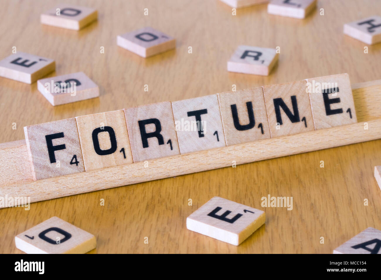 Scrabble letters spelling out the word Fortune Stock Photo - Alamy