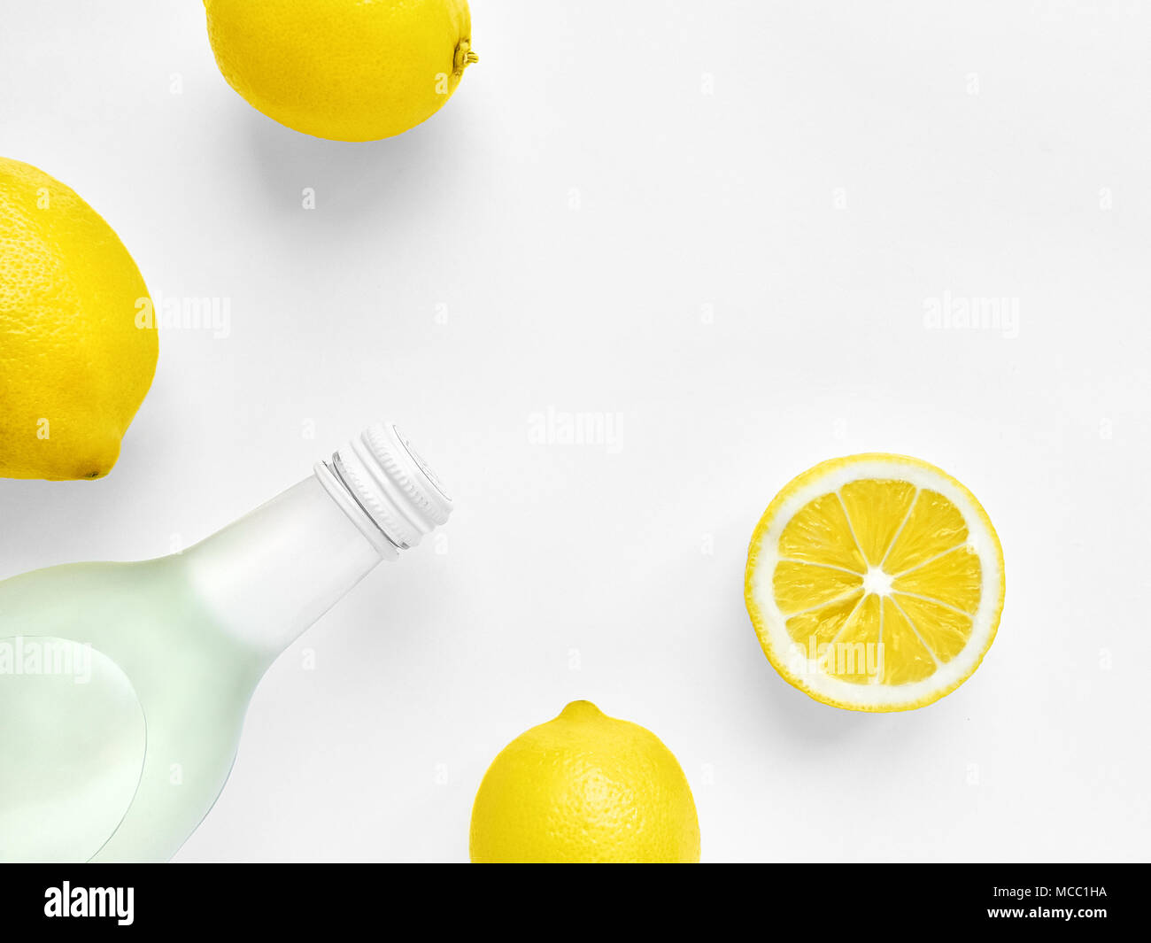 Lemonade in bottle Transparent glass bottle with lemonade, two whole ...