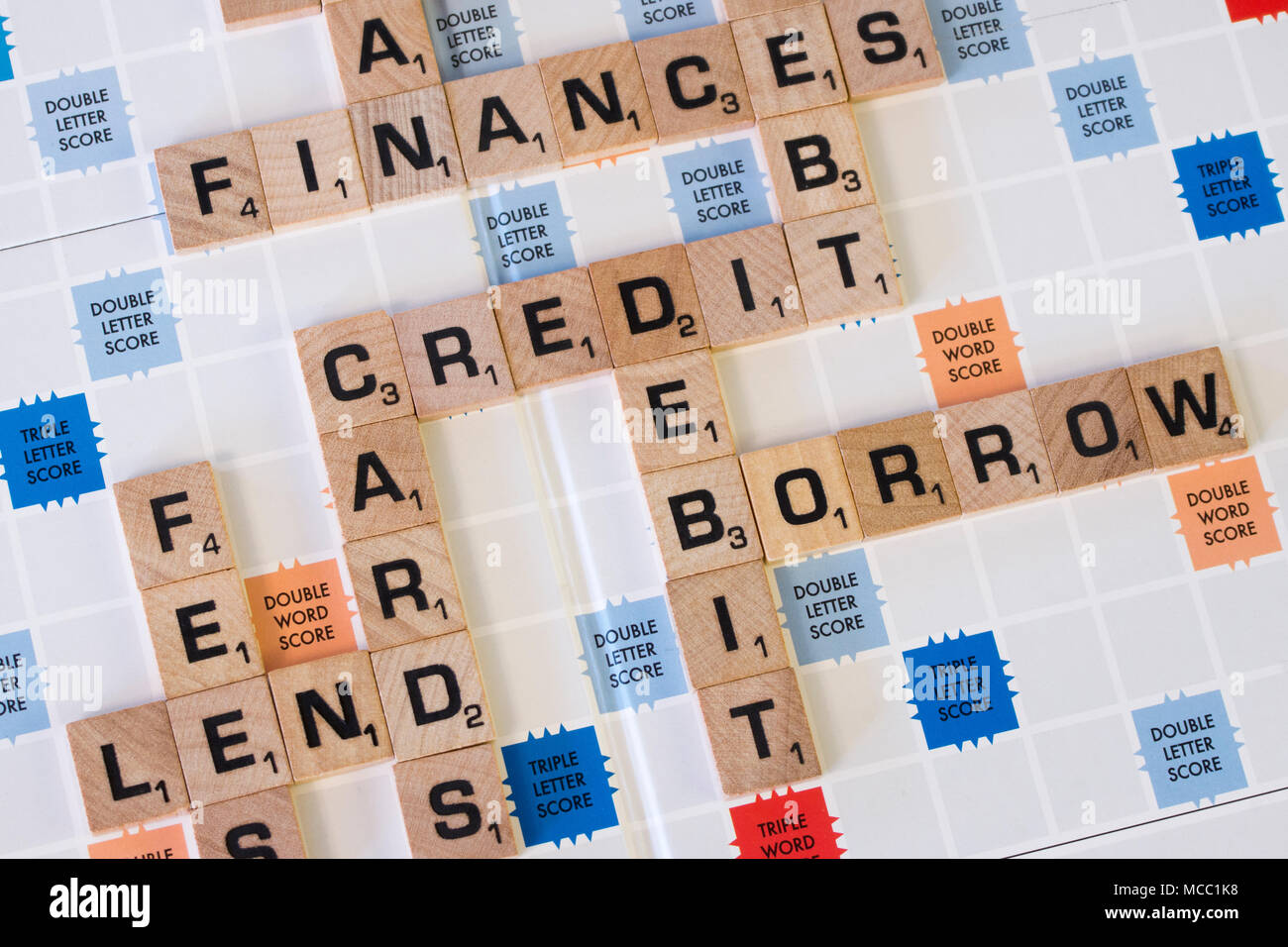 Spelling out words with scrabble tiles hi-res stock photography and ...