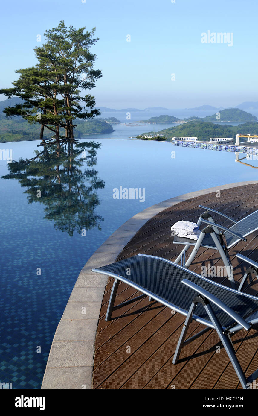 Spa resort hotel infinity swimming pool Stock Photo - Alamy
