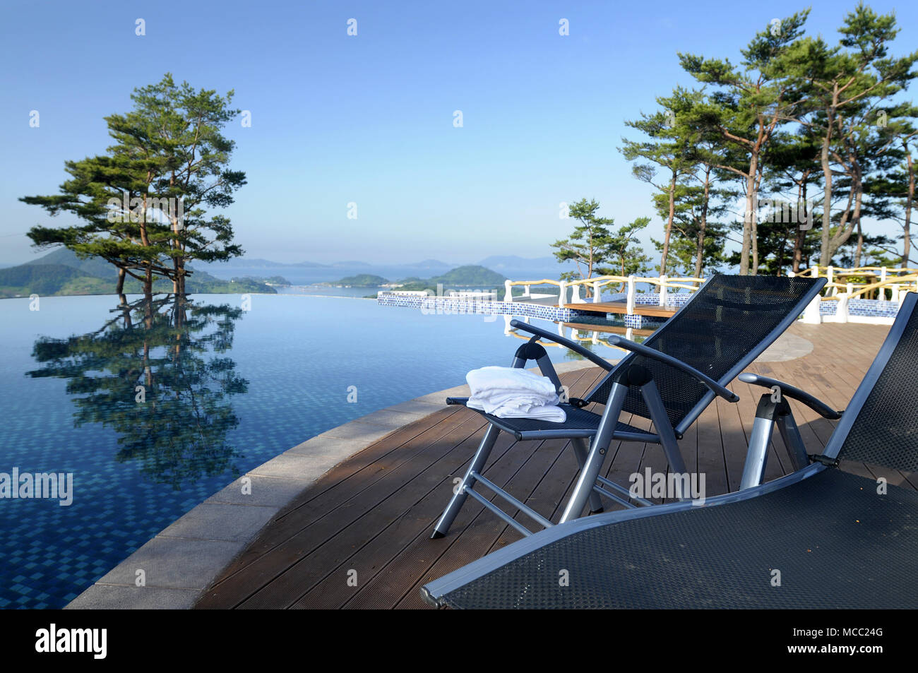 Spa resort hotel infinity swimming pool Stock Photo - Alamy