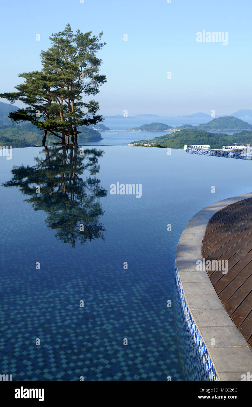 Spa resort hotel infinity swimming pool Stock Photo - Alamy
