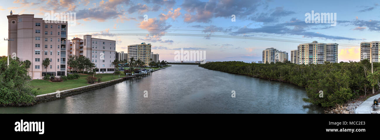 Sunset sky and clouds over the Vanderbilt Channel river near Delnor ...