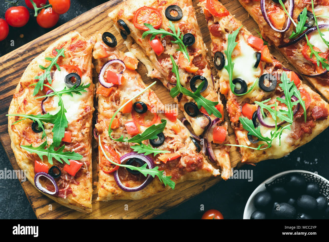 Flatbread pizza cut into slices. Top view, closeup Stock Photo - Alamy