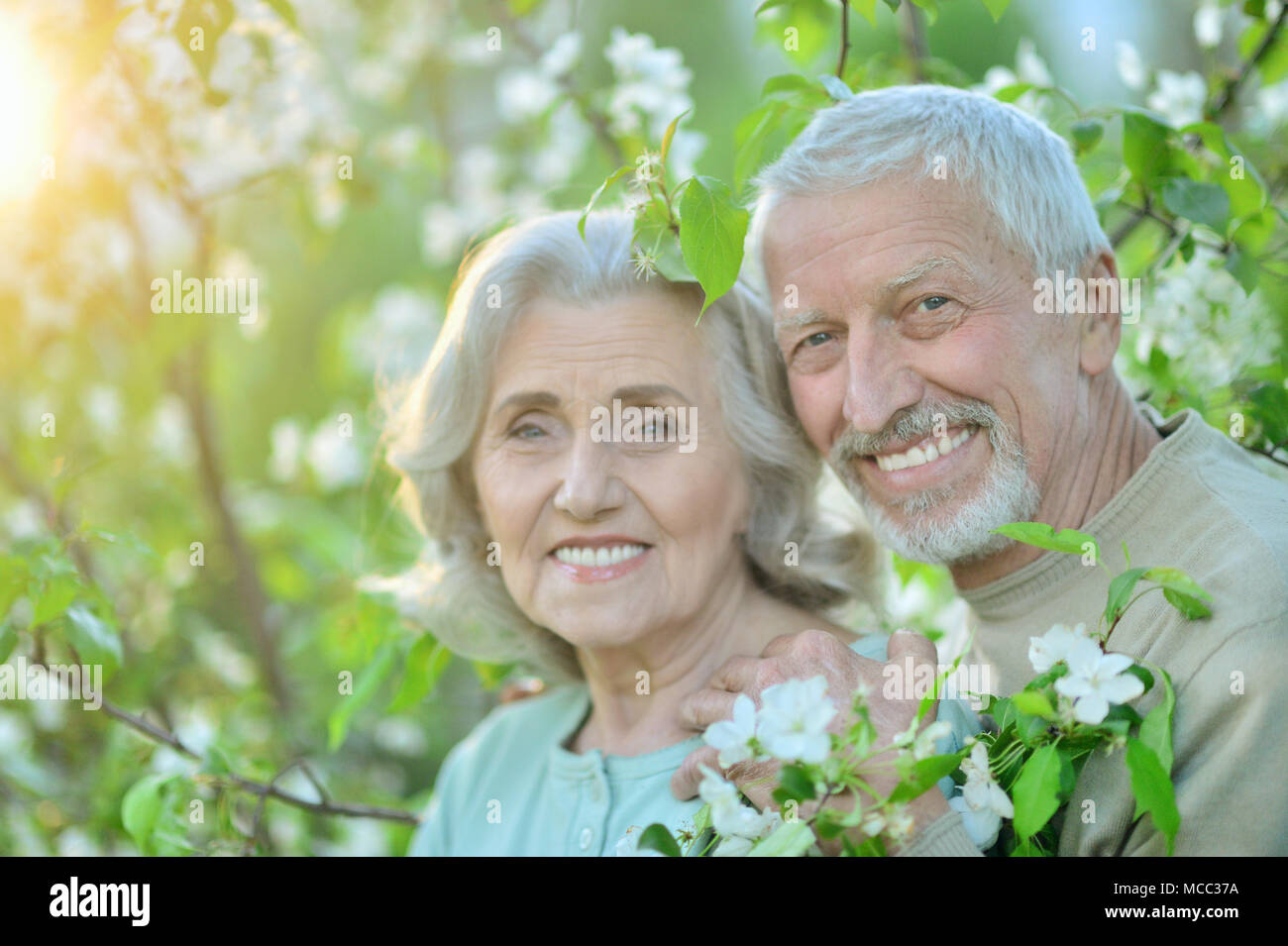 Happy elder couple hugging Stock Photo - Alamy