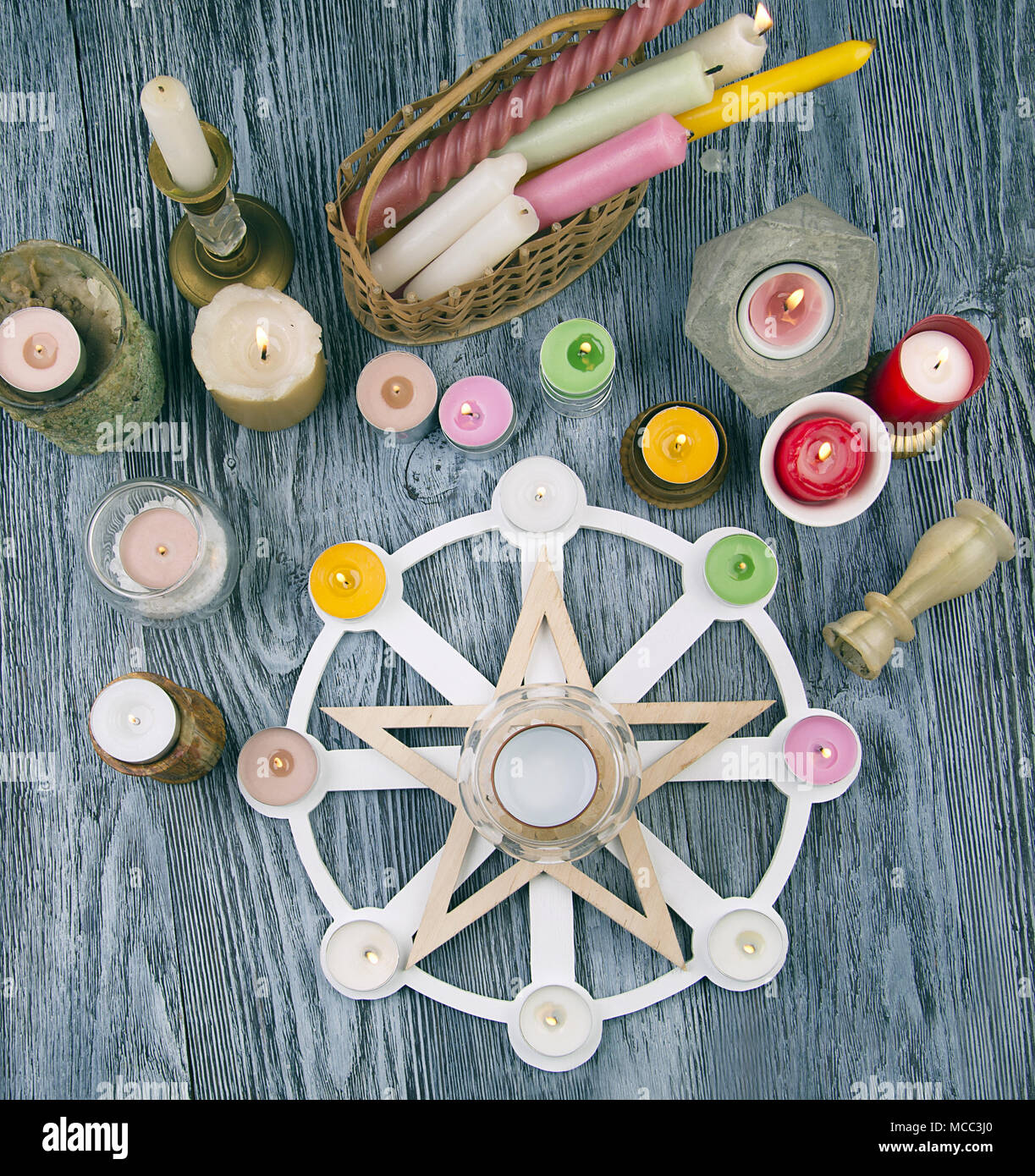 Altar with Wheel of year, pentagram and colorful candles Stock Photo ...