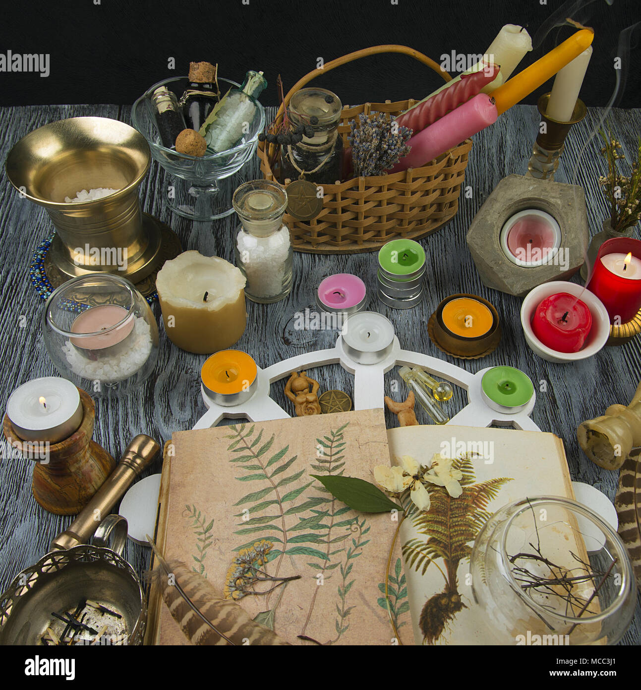 Altar with Wheel of year, pentagram and colorful candles Stock Photo ...
