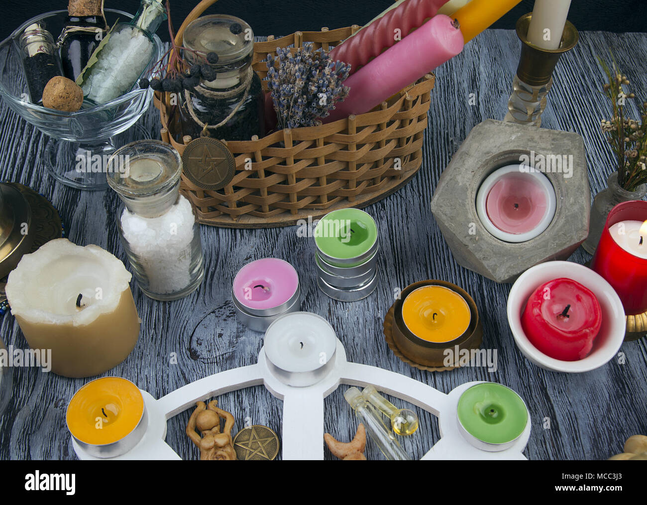 Altar with Wheel of year, pentagram and colorful candles Stock Photo ...