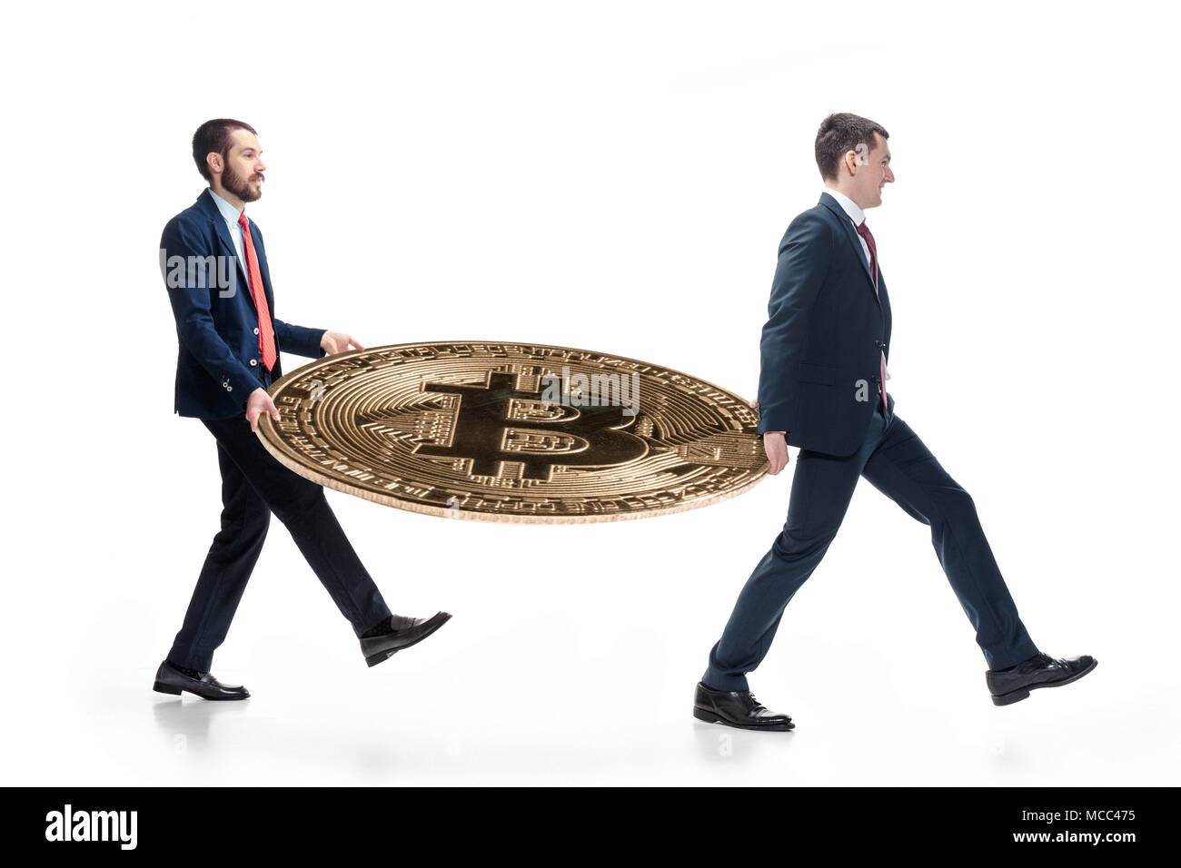 Two casual man holding business icon Stock Photo - Alamy