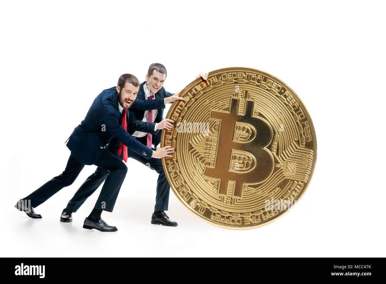 Two businessmen holding business icon Stock Photo - Alamy