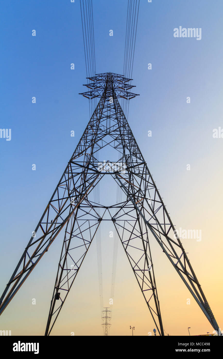uprisen angle of high voltage pole in sunset time sky Stock Photo - Alamy