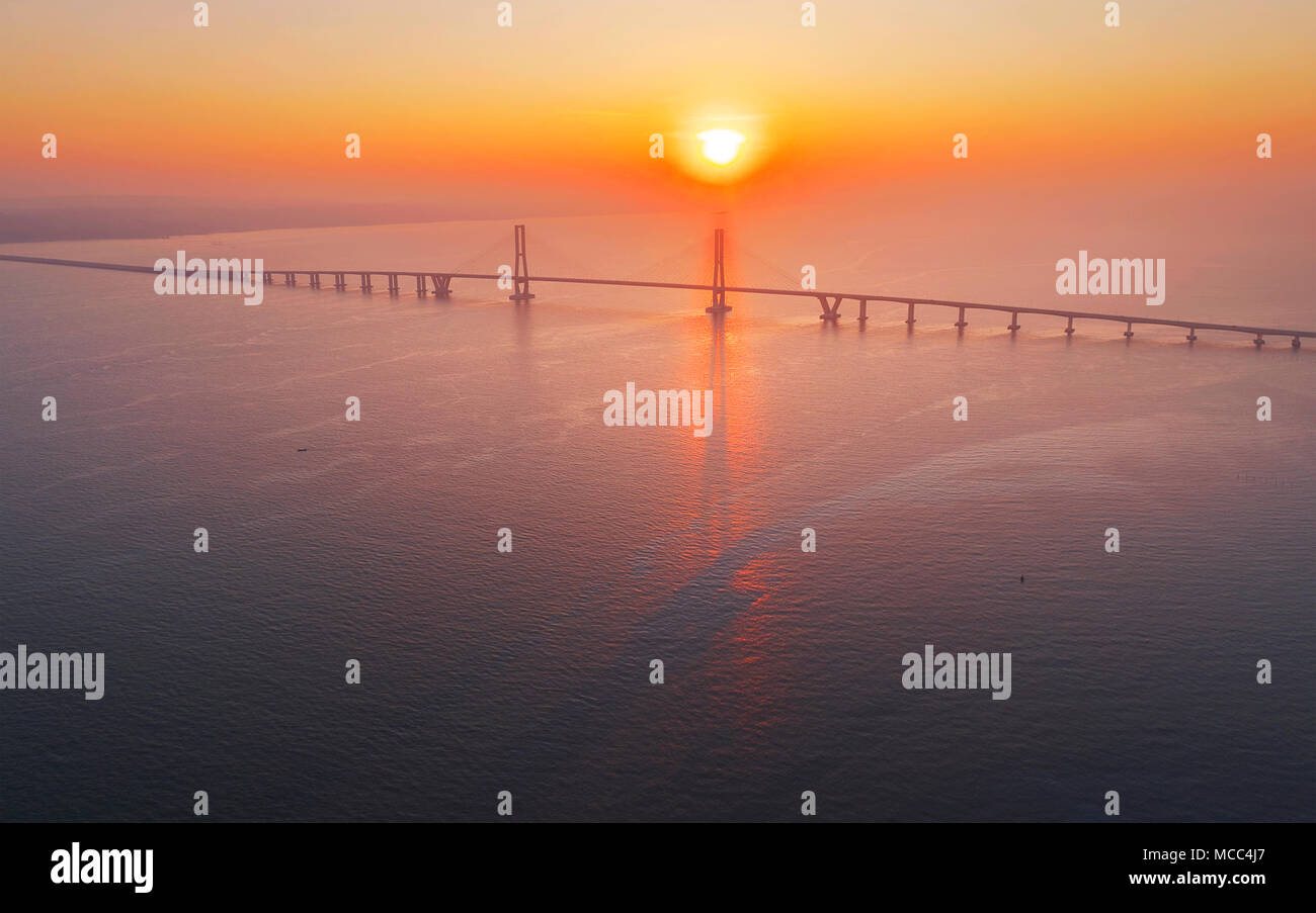 Aerial view of Suramadu National Bridge at sunrise located in Surabaya ...