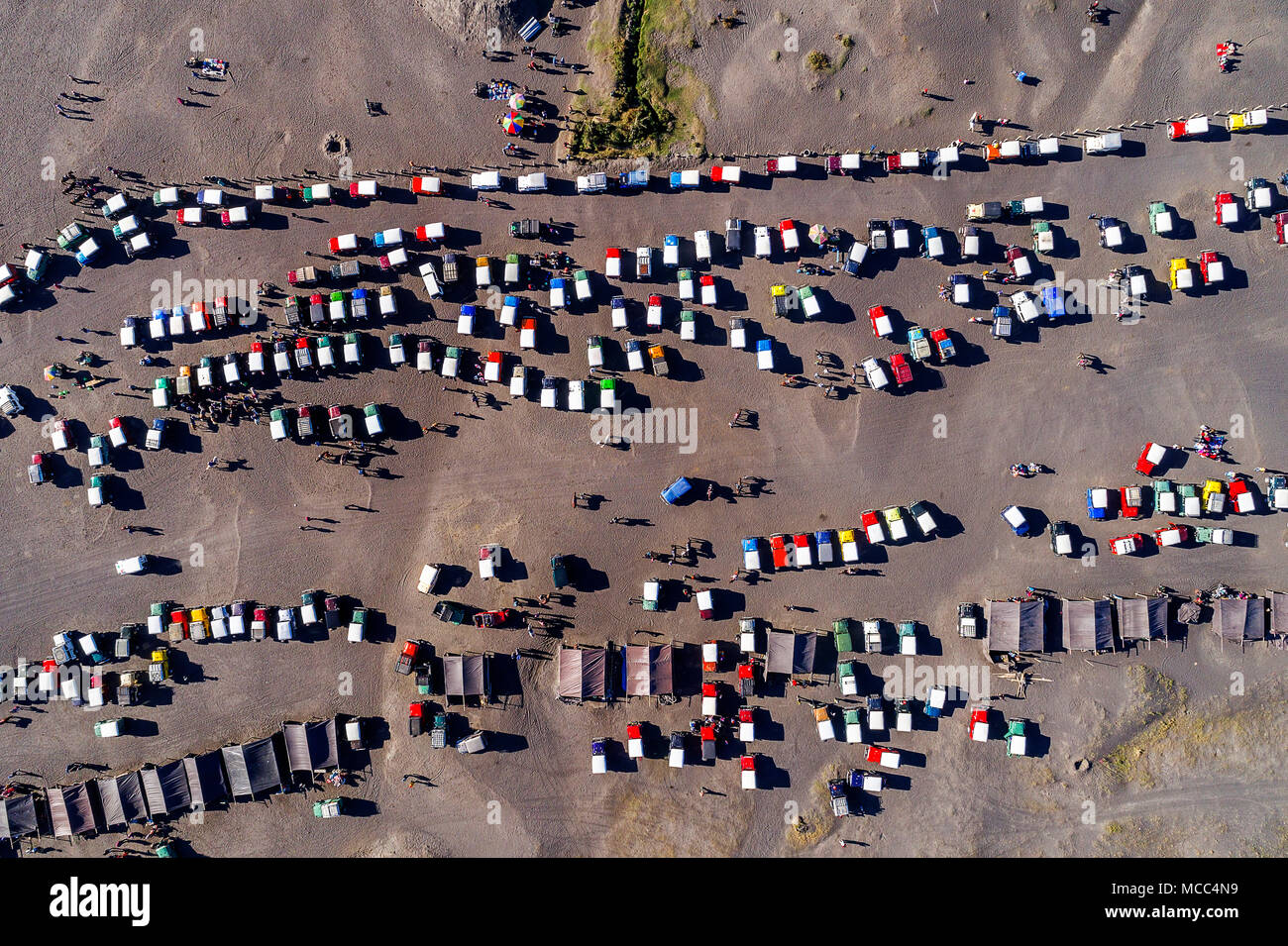 Aerial view of tourist jeeps waiting for people at parking lot in Bromo ...