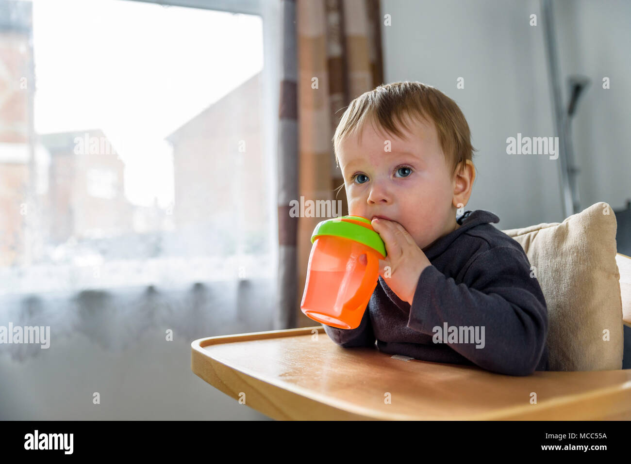 Young boy drinking from beaker hi-res stock photography and images - Alamy