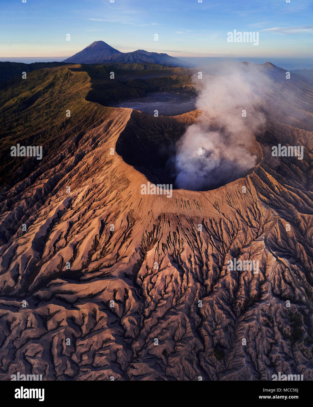 Aerial Panoramic view of Mount Bromo covered with mist at sunrise ...