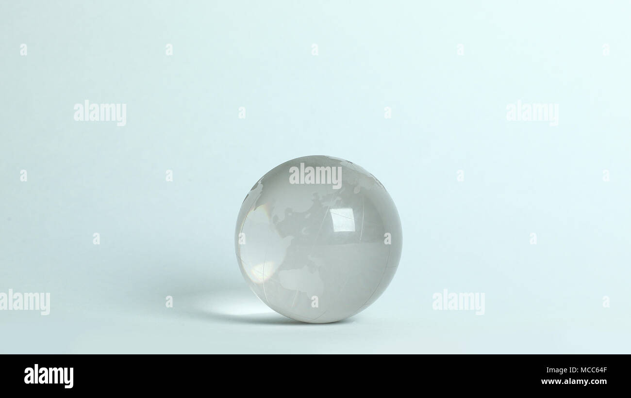 small glass globe.isolated on a white background Stock Photo - Alamy