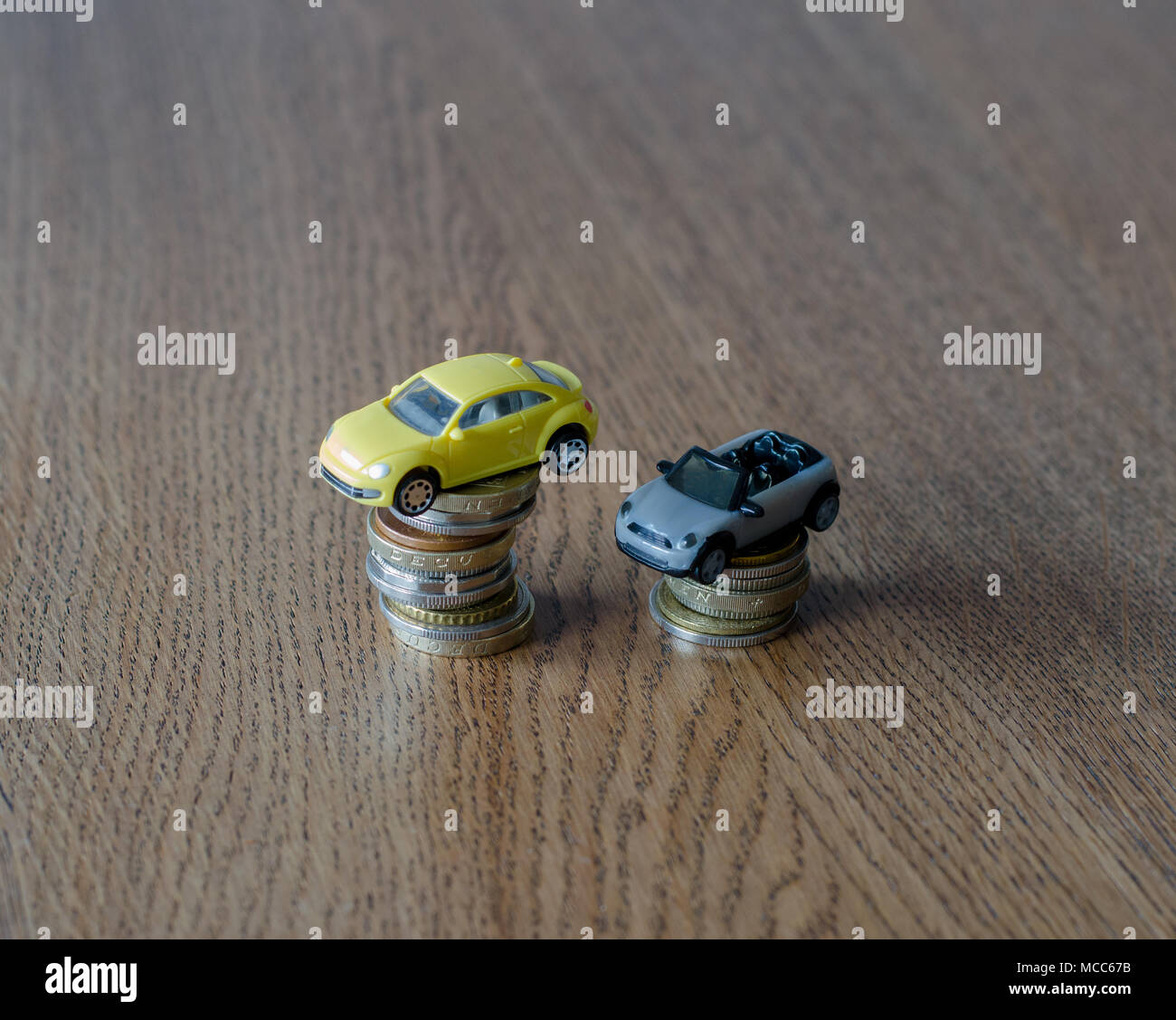 Miniature cars coins hi-res stock photography and images - Alamy