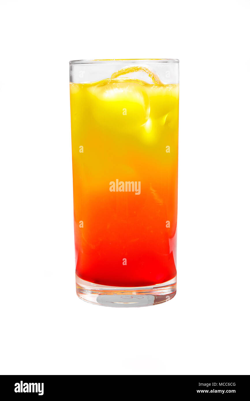 A multicolored, two-layered opaque cocktail in a tall glass with ice ...