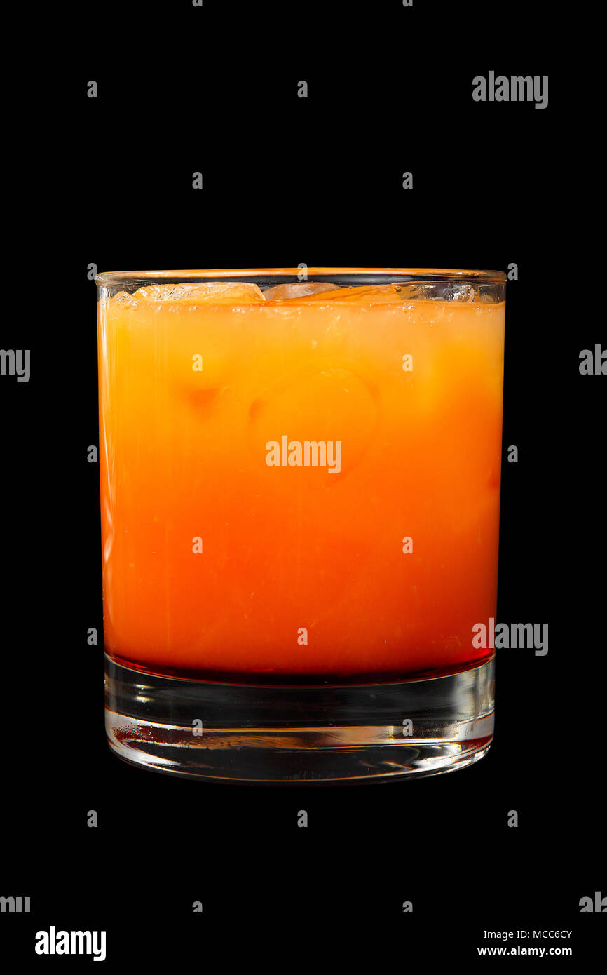 A Multicolored Two Layered Opaque Cocktail In A Low Glass With Ice Cubes With The Taste Of 