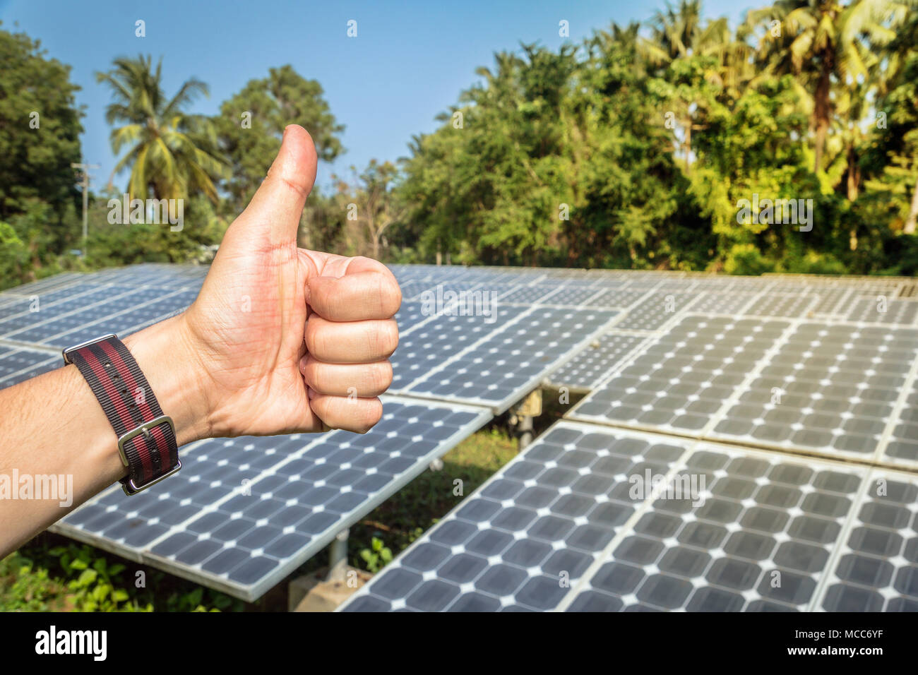 Hand showing Thumbs Up By the backdrop is solar energy. hand with thumb ...