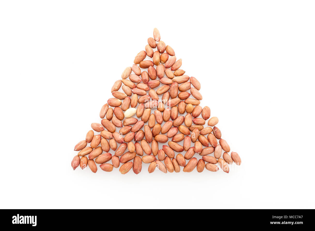 The shape of a triangle of peeled peas on a white table close-up Stock ...