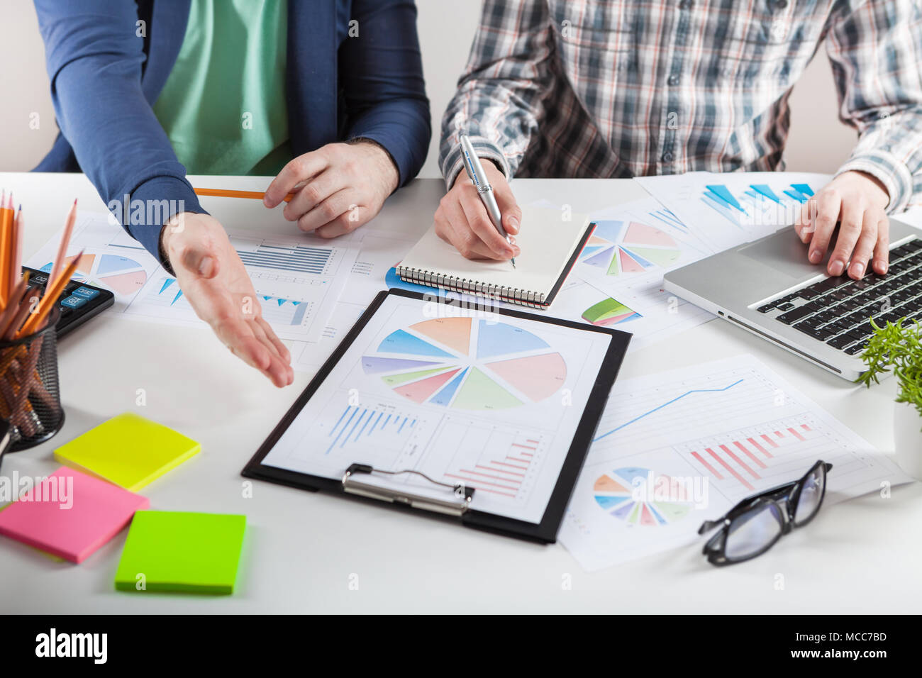 Stock market chart and finger pointing Stock Photo - Alamy