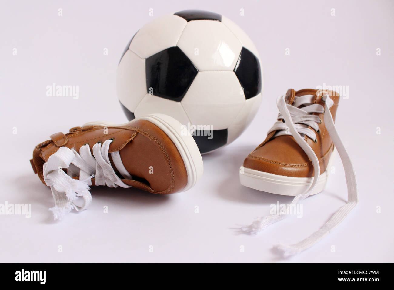 Soccer ball football with shoes collage Stock Photo - Alamy