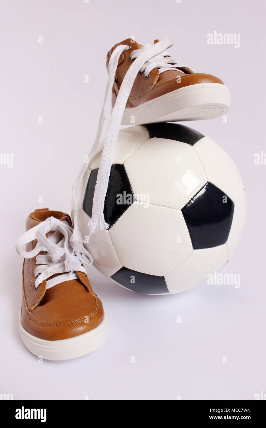 Soccer ball football with shoes collage Stock Photo - Alamy